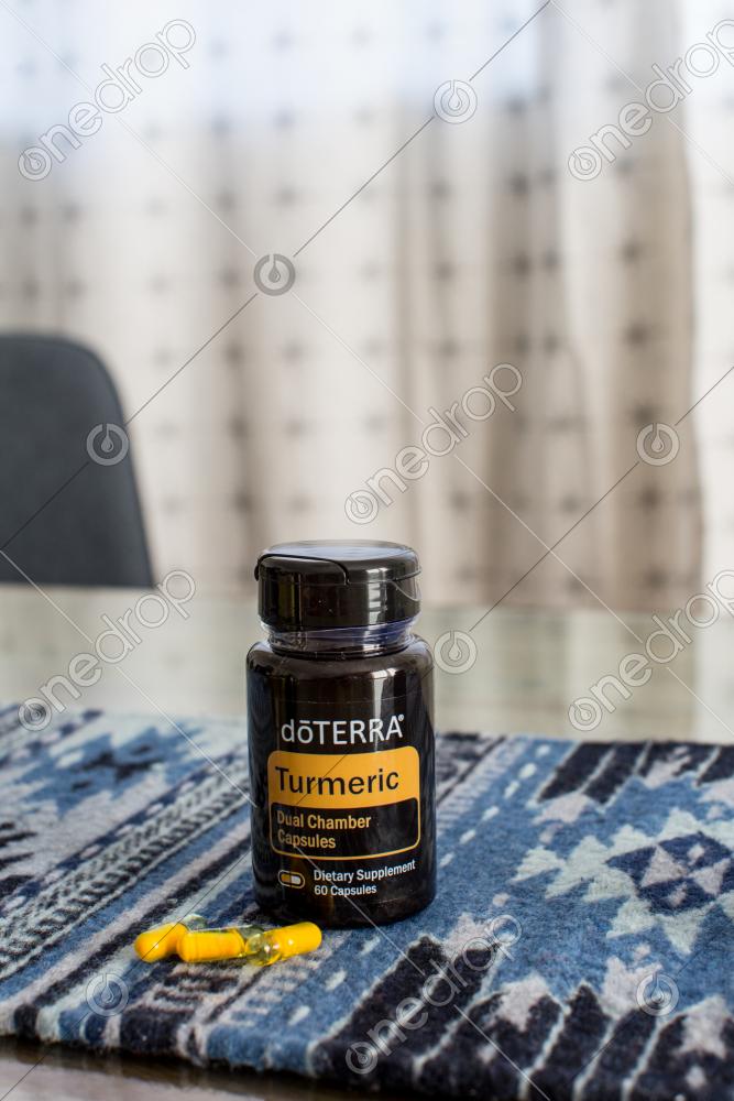 Turmeric Duo Capsules on blue by Gretchen Korf