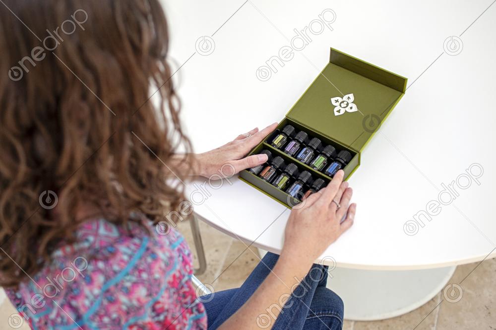 Woman Holding Family Essentials Kit by Pixel Perfect