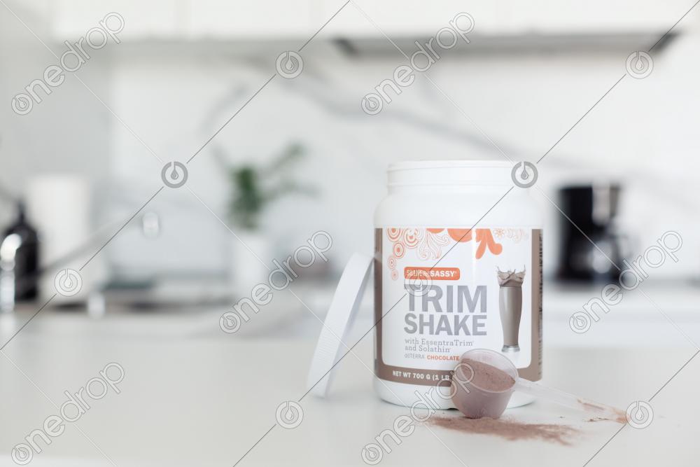 Opened Slim & Sassy TrimShake Chocolate in kitchen inter by Kseniia Che