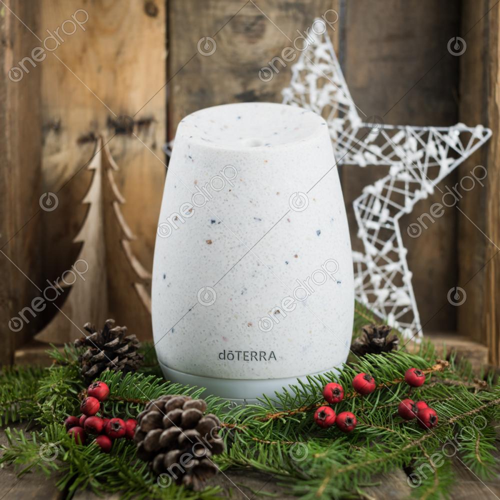 Roam Diffuser with holiday greenery with rustic wood backgro by Sally ...